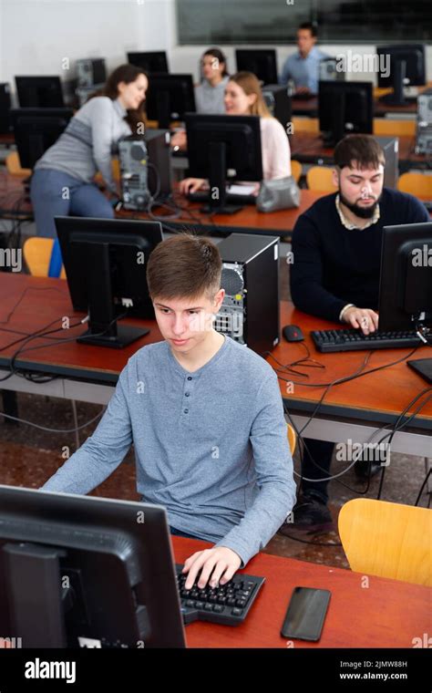 Computer Lessons For Adults In Classroom Stock Photo Alamy