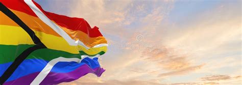 Gay Of South Africa Flag Waving In The Wind At Cloudy Sky Freedom And