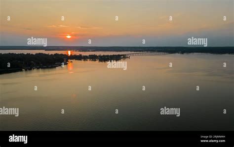 An Aerial View Of A Sailboat Bridge On Grand Lake Oklahoma Illuminated