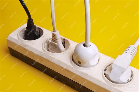 Premium Photo Electrical Extension Cord With Different Plugs On