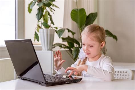 Premium Photo The Girl Learns Communicates Talks Through A Computer