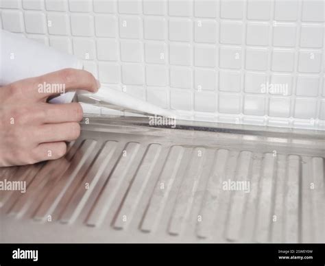 Using Silicone Adhesive To Installing A Sink In The Kitchen
