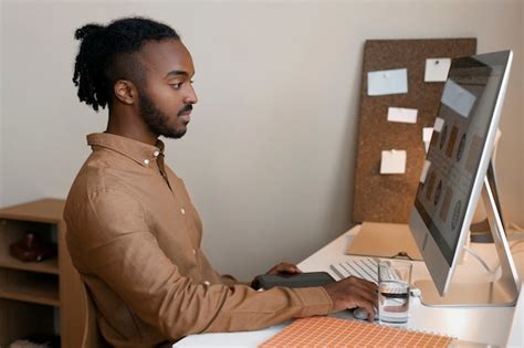 Premium Photo Man Working On Computer Side View