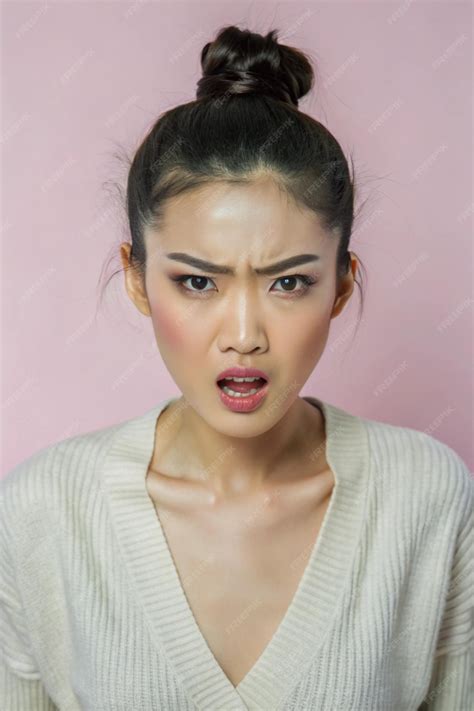 Portrait Of Beautiful Young Asian Woman With Angry And Furious Face