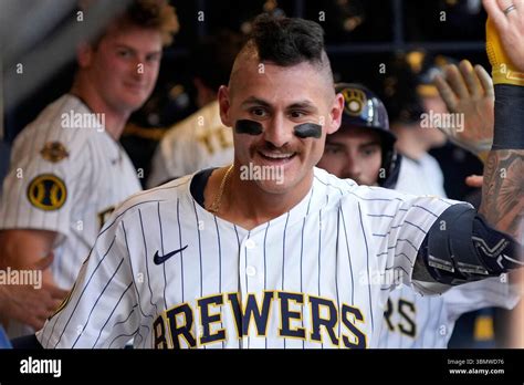 Milwaukee Brewers Joey Ortiz High Fives Teammates After Hitting A Two