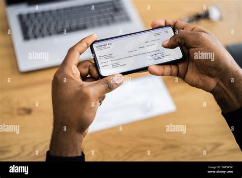 Remote Check Deposit Using Mobile Remote Taking Photo Stock Photo Alamy