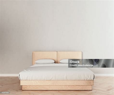 현대적인 인테리어 배경의 수평 모형 포스터 프레임 흰색 침실의 깨끗한 침구가있는 자연 채광 나무 침대 프레임 스칸디나비아 스타일 3d 렌더링 3d 일러스트 레이션 침대
