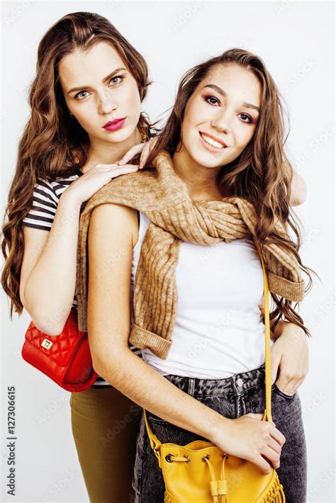 Two Best Friends Teenage Girls Together Having Fun Posing Emotional On White Background