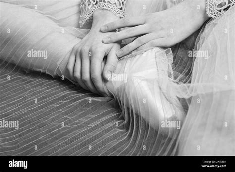 Female Ballerina Feet In Pointes On A Wooden Floor Closeup Monochrome
