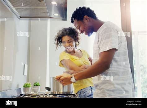 Its Getting Hot In Here A Young Couple Cooking Together In The Kitchen