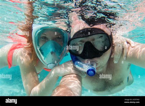 A Couple In Love Taking Selfie Underwater In Indian Ocean Maldives