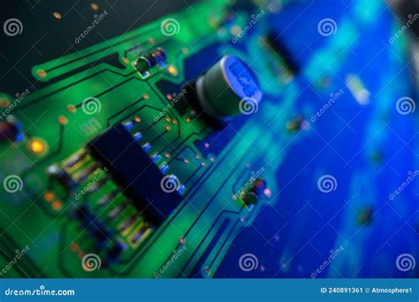 Detail Of A Microprocessor Resistors And Capacitors Soldered To A Green Glowing Pcb Stock Image