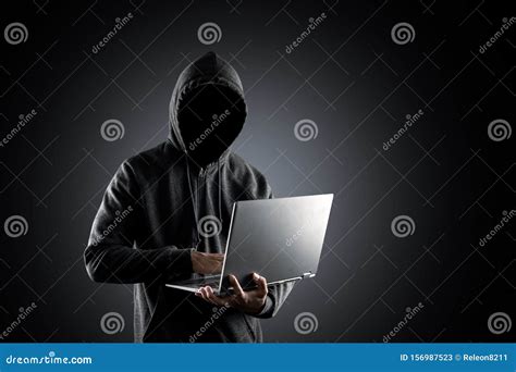 Cybercrime Hacking And Technology Crime Male Hacker In Dark Room With Laptop Computer Hacker