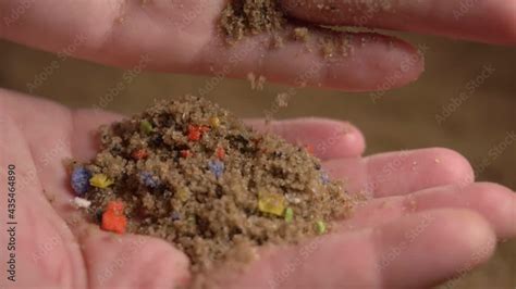 Stockvideo Microplastics On Sandy Beaches Tiny Multicolored Plastic