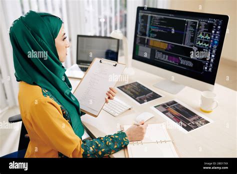 Serious Pensive Young Muslim Software Developer Looking On Programming Code On Computer Screen