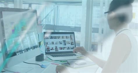 Animation Of Graph Globe And Computer Language Over Asian Woman Working On Laptop In Office