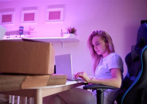 Premium Photo Young Blonde Woman Barcode Printer And Boxes On The