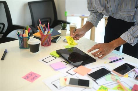 Team Of Creatives Collaborating On A Ux Ui Project At Workspace Filled
