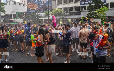 People Particpate In Water Gun Fights Along Silom Road During Songkran