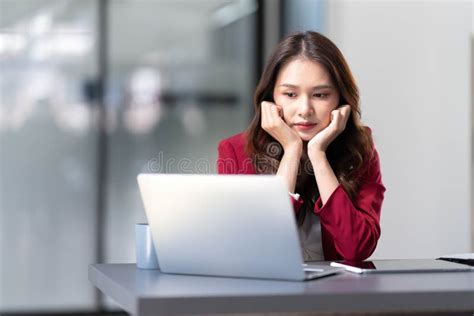 Asian Woman Thinking Hard Concerned About Online Problem Solution Looking At Laptop Screen