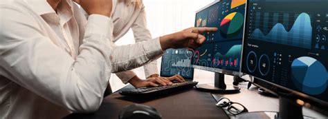analyst working on bi dashboard on computer monitor trailblazing stock