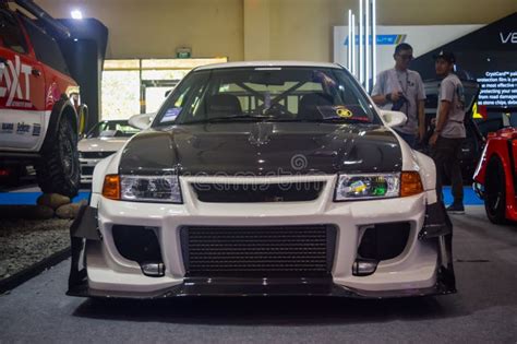 Front Shot Of A Modified White Mitsubishi Lancer Evolution V In Indonesia Modification Expo 2023