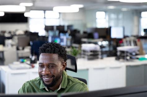 Smiling Man Working At Office Desk Focusing On Computer Screen Copy Space Stock Image Image
