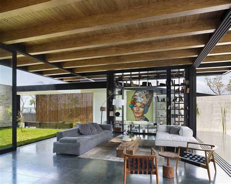 The Exposed Wood Ceiling Of This Home Shows Off Its Structure