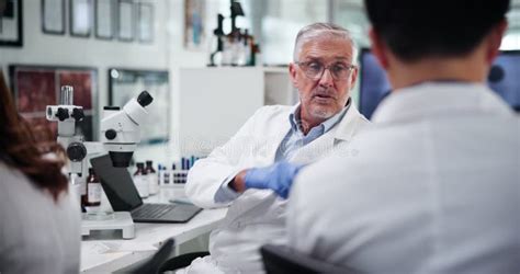 Mature Scientist Man And Team With Sample At Lab For Problem Solving