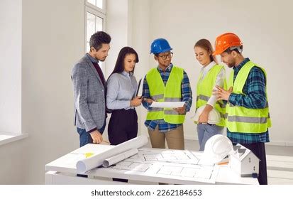 Team Male Female Architects Builders Discussing Stock Photo Shutterstock