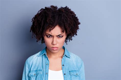 Portrait Of Unsatisfied Capricious Angry Girl Wear Denim Clothes Sullen Face Look Camera On Gray