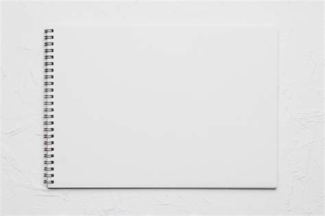 Premium Photo White Empty Sketchbook On Rough Surface