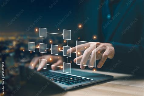 Businessman Using A Laptop Shows A Business Process Hierarchy Scheme