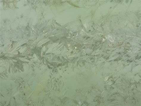 Intricate Textures And Patterns Of Frosted Green Glass Surface Design