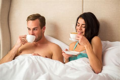 Premium Photo Couple Drinking Coffee In Bed