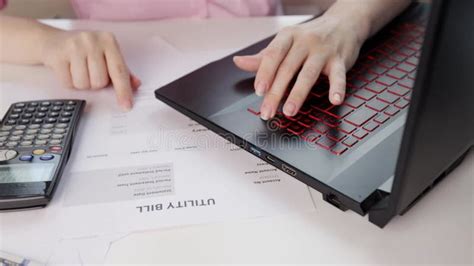 Utility Receipt Power Bill With Electricity And Gas Charges A Woman At Her Desk Counts The