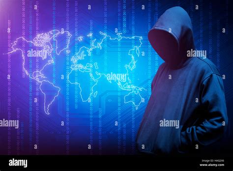 Computer Hacker Silhouette Of Hooded Man With Binary Data And Network Security Terms Stock Photo