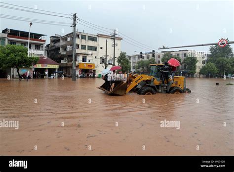 Chinese Rescuers Evacuate Local Residents In Floodwater Caused By Heavy