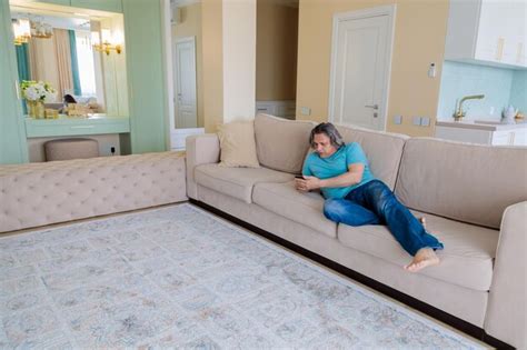 Premium Photo An Adult Man Browses Social Networks On A Mobile Phone