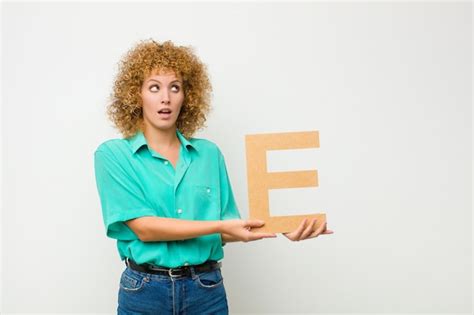 Premium Photo Portrait Of A Woman On A Grey Background