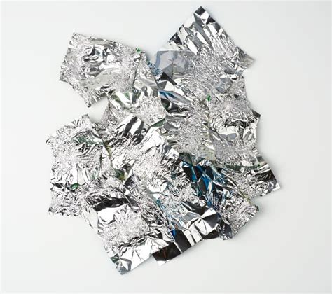 Various Crumpled Foil Used Candy Wrappers On A White Background Stock Image Image Of