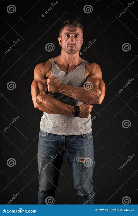 Athletic Man Cross Strong Muscular Arms With Biceps Triceps Muscles In
