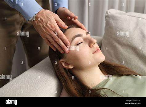 Psychologist Working With Patient During Hypnosis Session Indoors