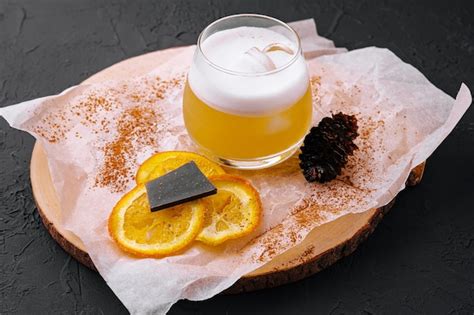 Premium Photo Glass Of Ruby Cocktail Garnished With Orange Zest