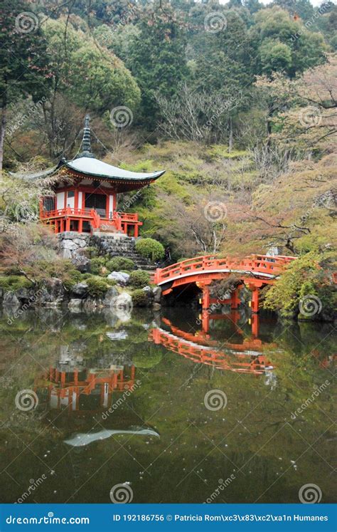 Beautiful Scenery Of A Japanese Pagoda In A Forest And A Red Arch
