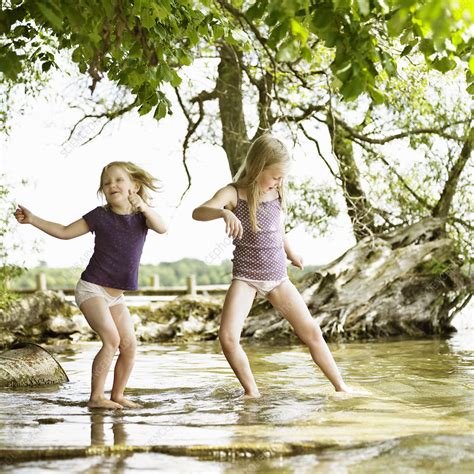 Smiling Girls Playing In Lake Stock Image F0044956 Science Photo