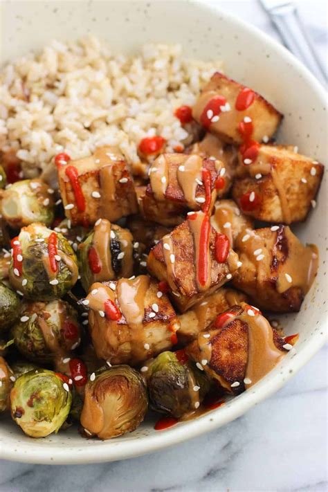 Sheet Pan Tofu With Peanut Sauce And Brussels Sprouts Is A Satisfying