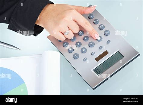 Female Hand Using Calculator Stock Photo Alamy
