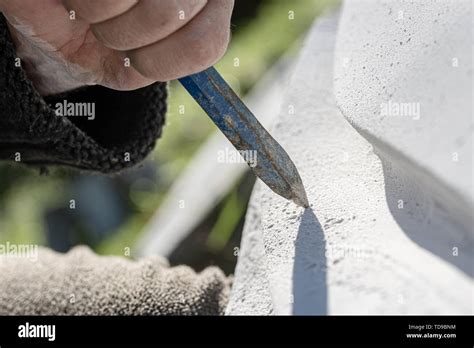 Closeup View Of Chisel As Sculptor Works And Carves In Stone Stock Photo Alamy
