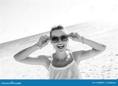 Happy Modern Woman On Seashore Holding Sunglasses Stock Image Image